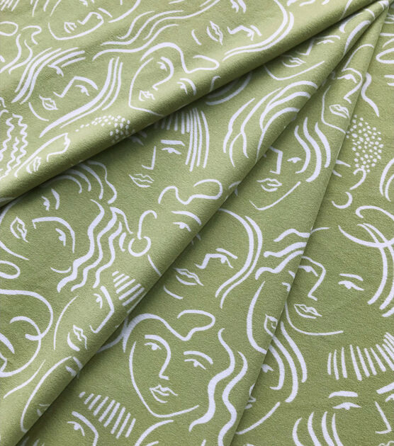 Abstract Faces Light Green Jersey Knit Fabric Joann