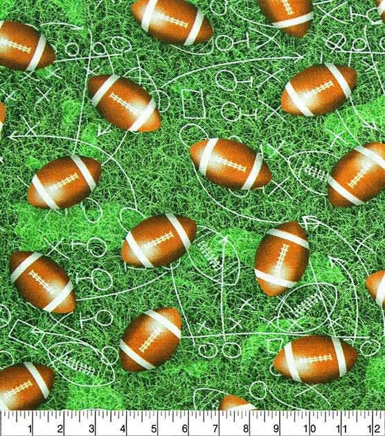 Footballs On Green Novelty Cotton Fabric Joann